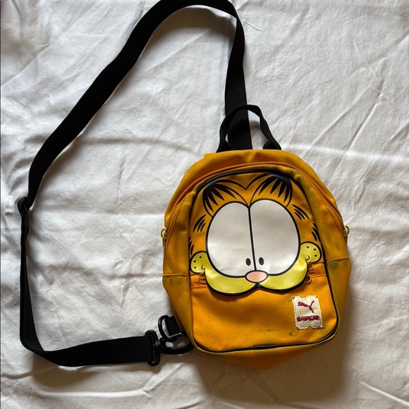 Puma | Accessories | Garfield Crossbody Bag With Black Strap | Poshmark
